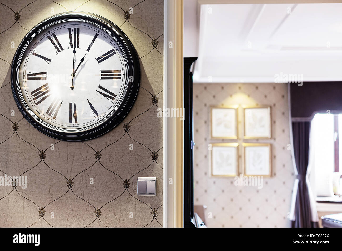 modern living room with a clock in the wall Stock Photo - Alamy