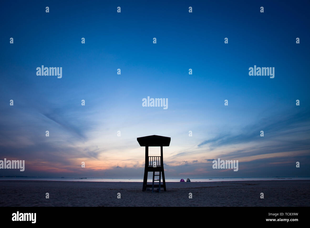 Observation tower on the beach with sunrise Stock Photo - Alamy