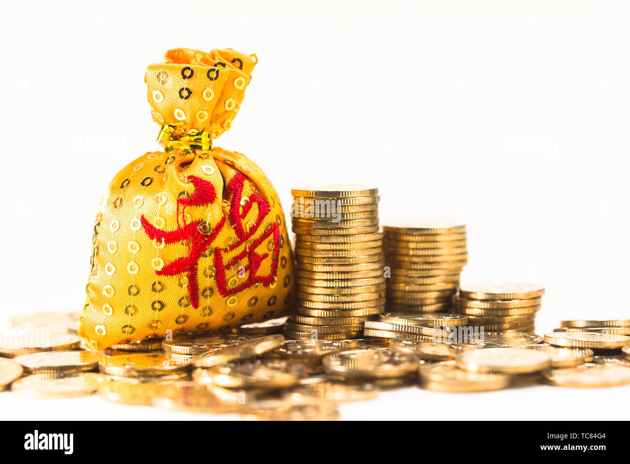 Fortune bag on white background with gold coin Stock Photo - Alamy