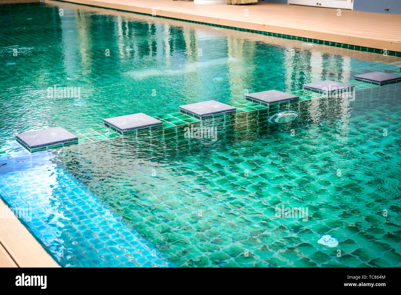 walkway on swimming pool Stock Photo - Alamy