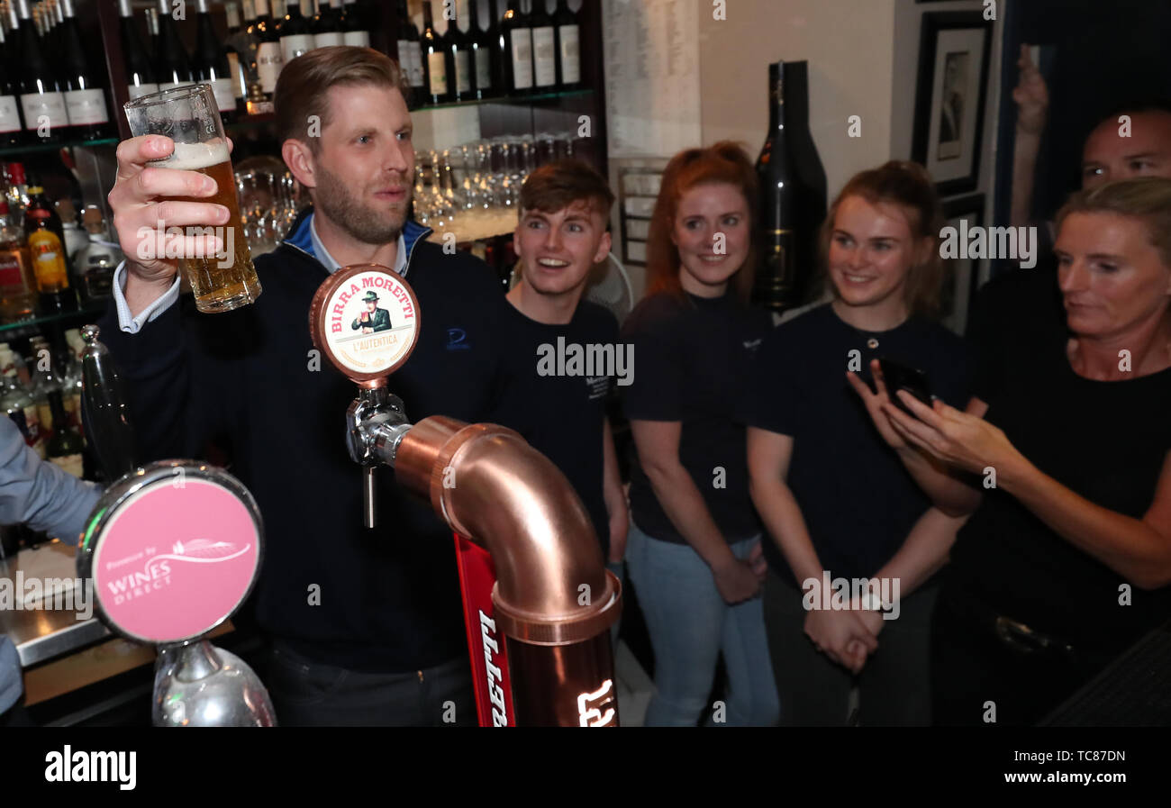 Eric Trump, the son of US President Donald Trump, pours drinks and ...