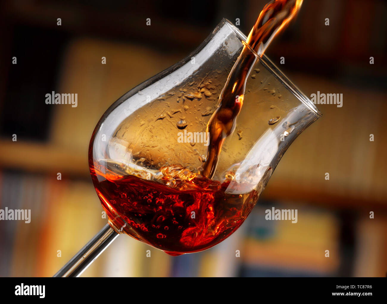 red wine poured in all its forms, library background Stock Photo - Alamy
