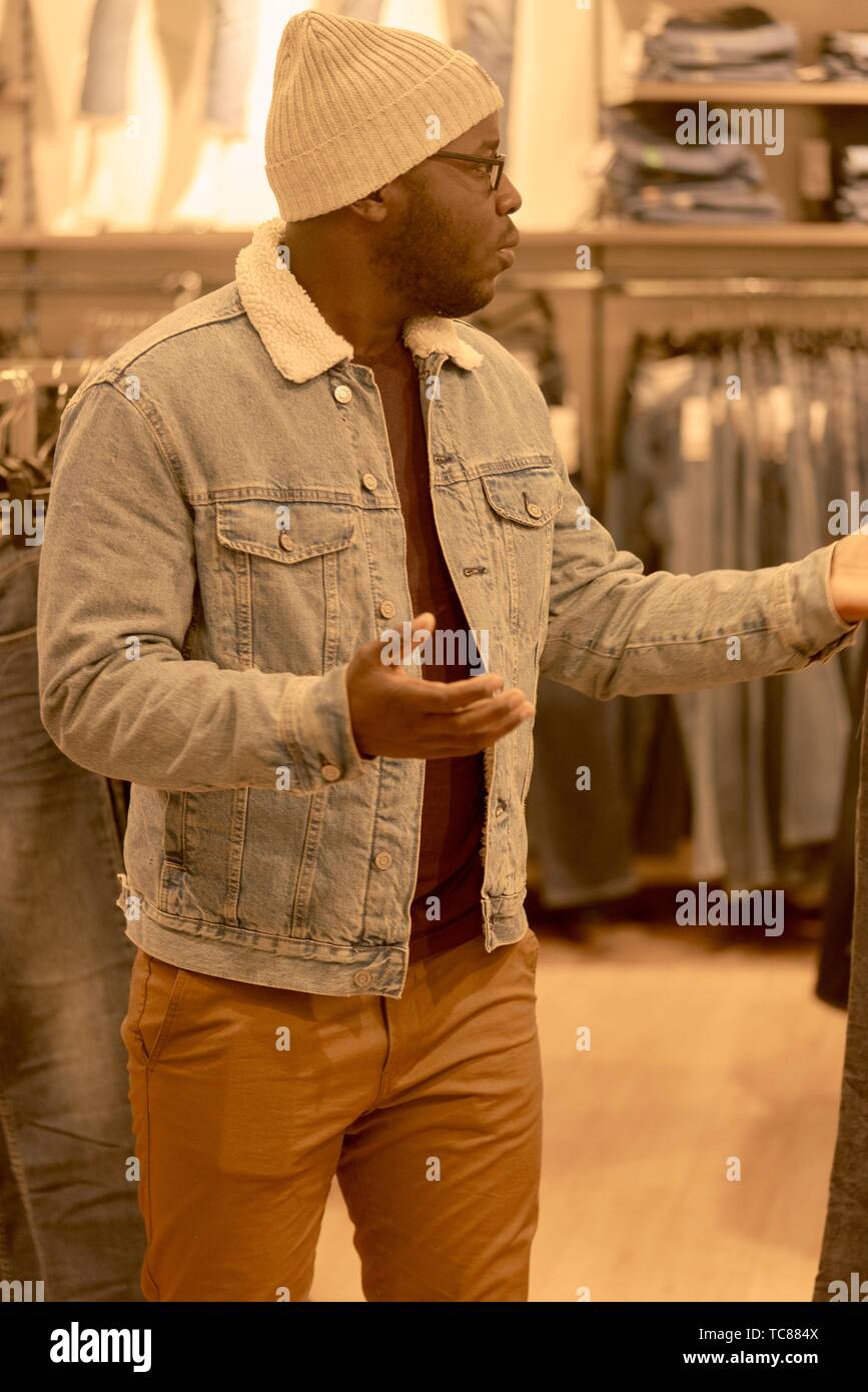 man in clothing store Stock Photo - Alamy
