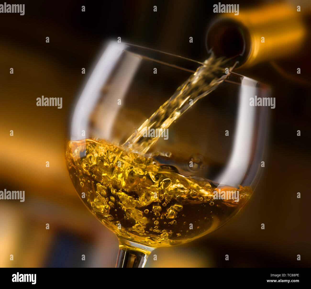 white wine poured in all its forms, library background Stock Photo - Alamy
