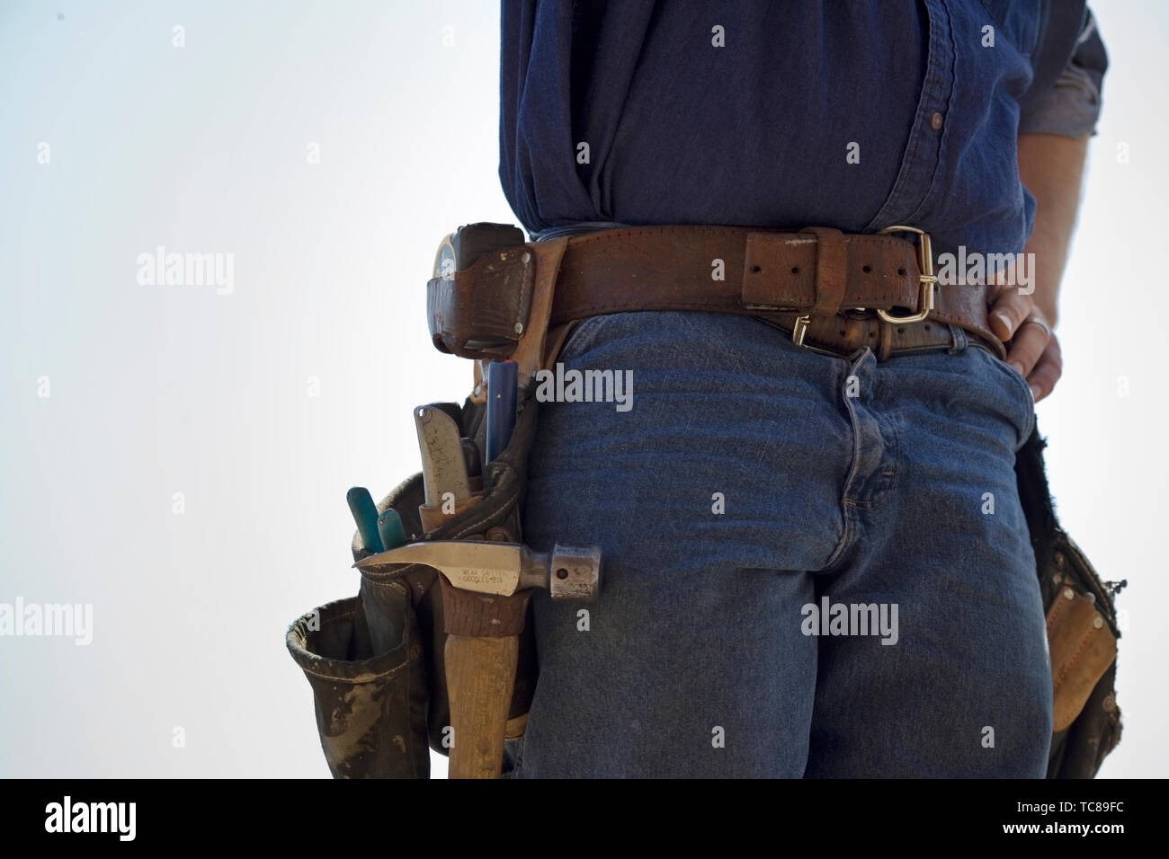 Tool belt being worn by a builder Stock Photo - Alamy