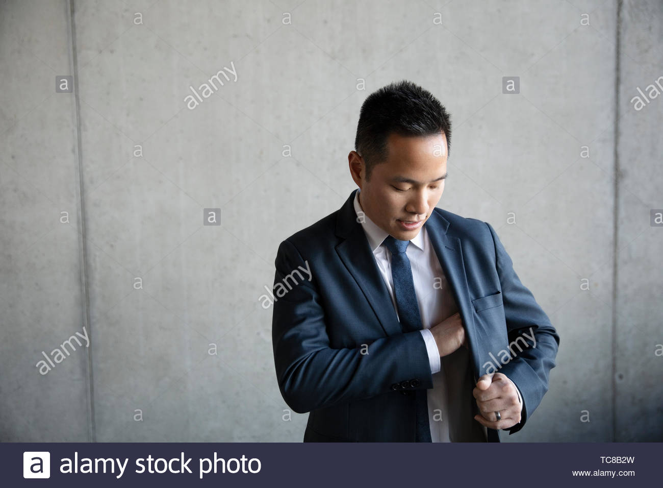 Reaching in jacket pocket hi-res stock photography and images - Alamy