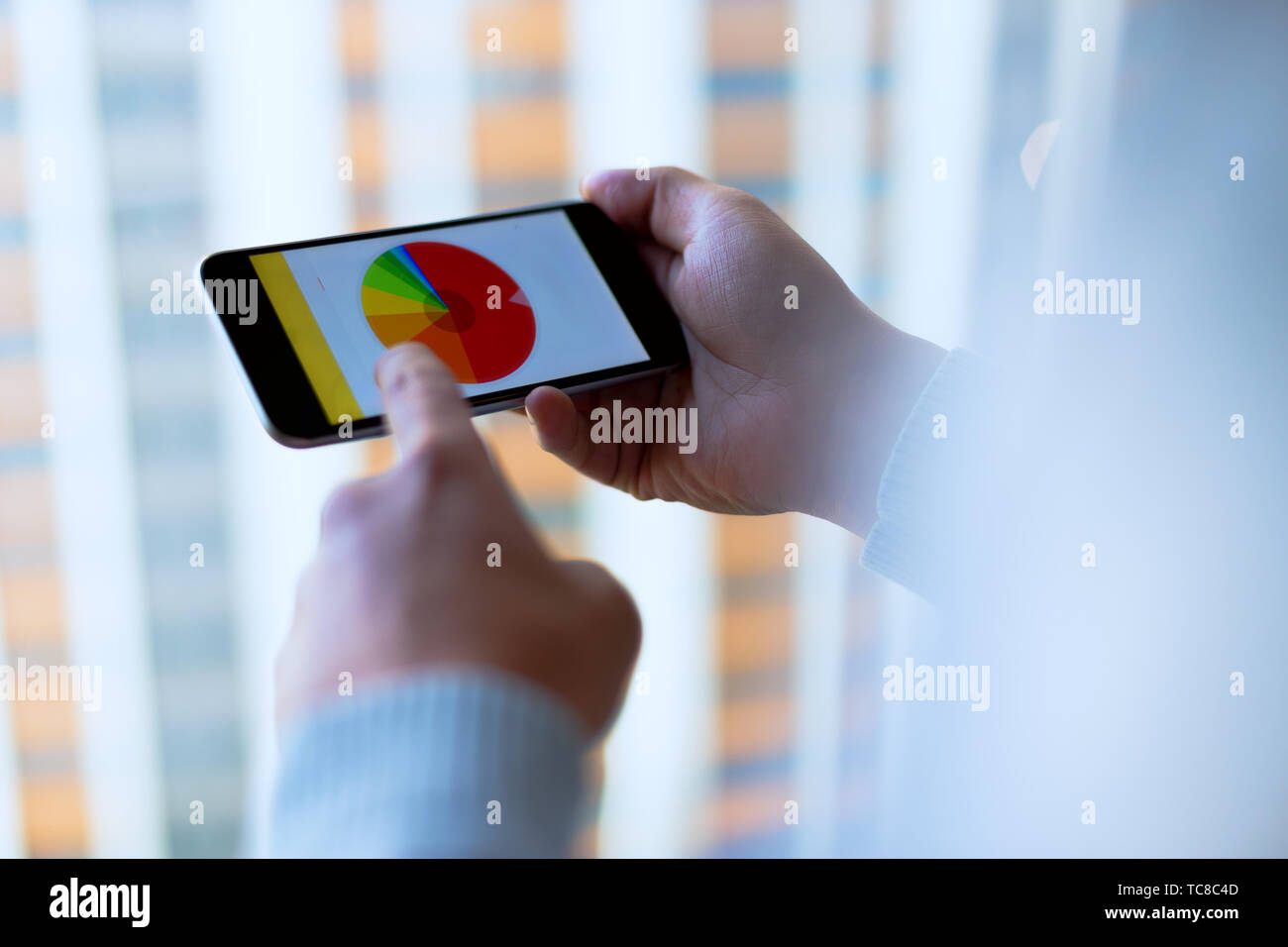 Mobile phone with stock market Stock Photo - Alamy