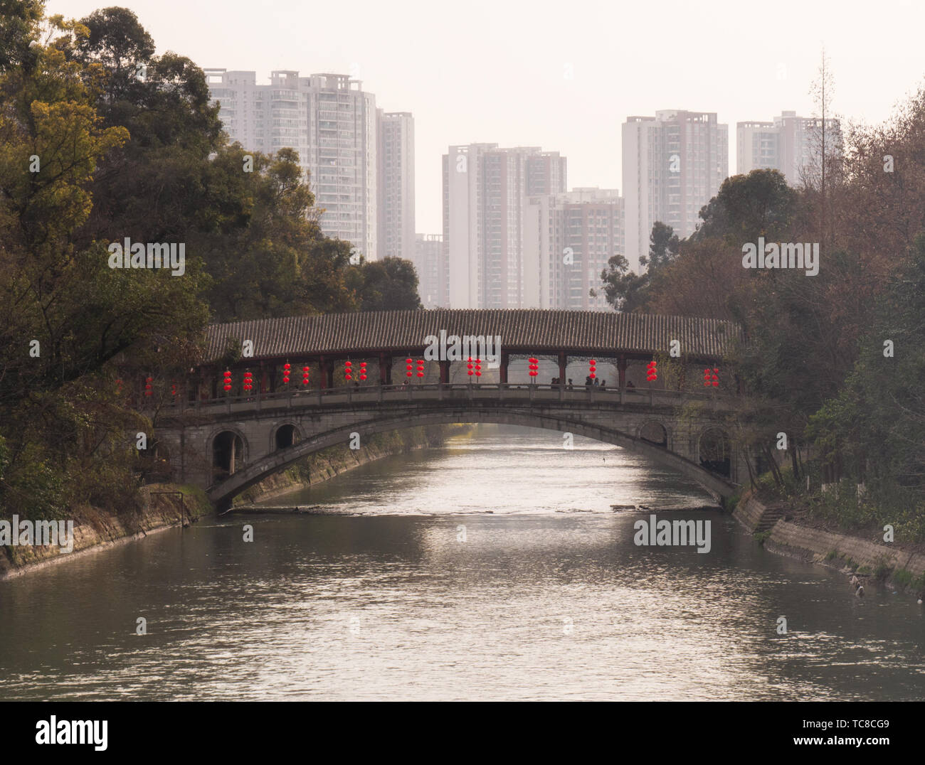 The ancient bridge on the Sha River in Chengdu and the modern ...