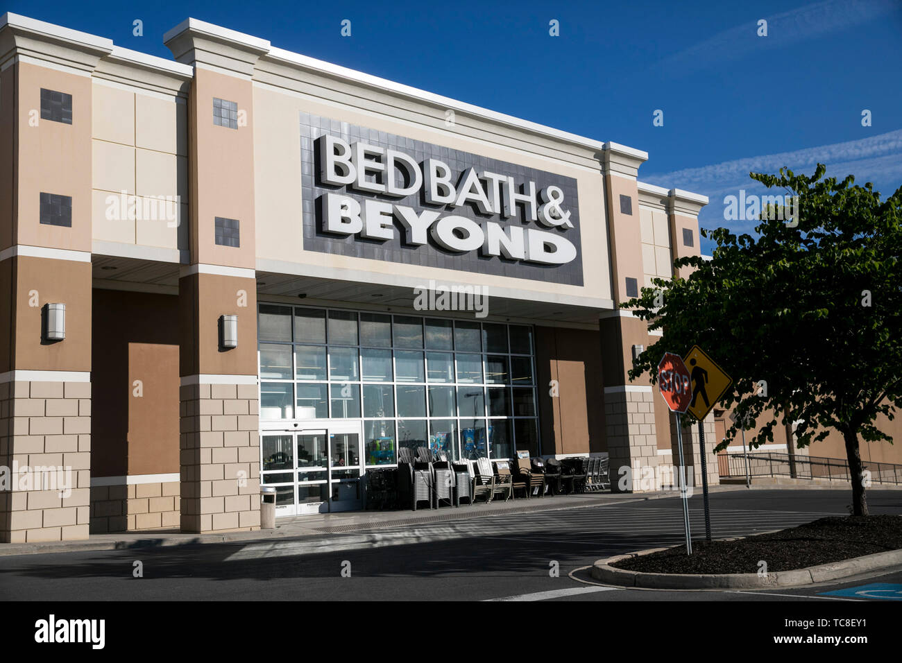 A logo sign outside of a Bed Bath & Beyond retail store location in Martinsburg, West Virginia ...