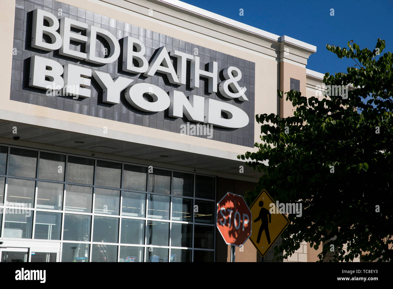 A logo sign outside of a Bed Bath & Beyond retail store location in Martinsburg, West Virginia ...