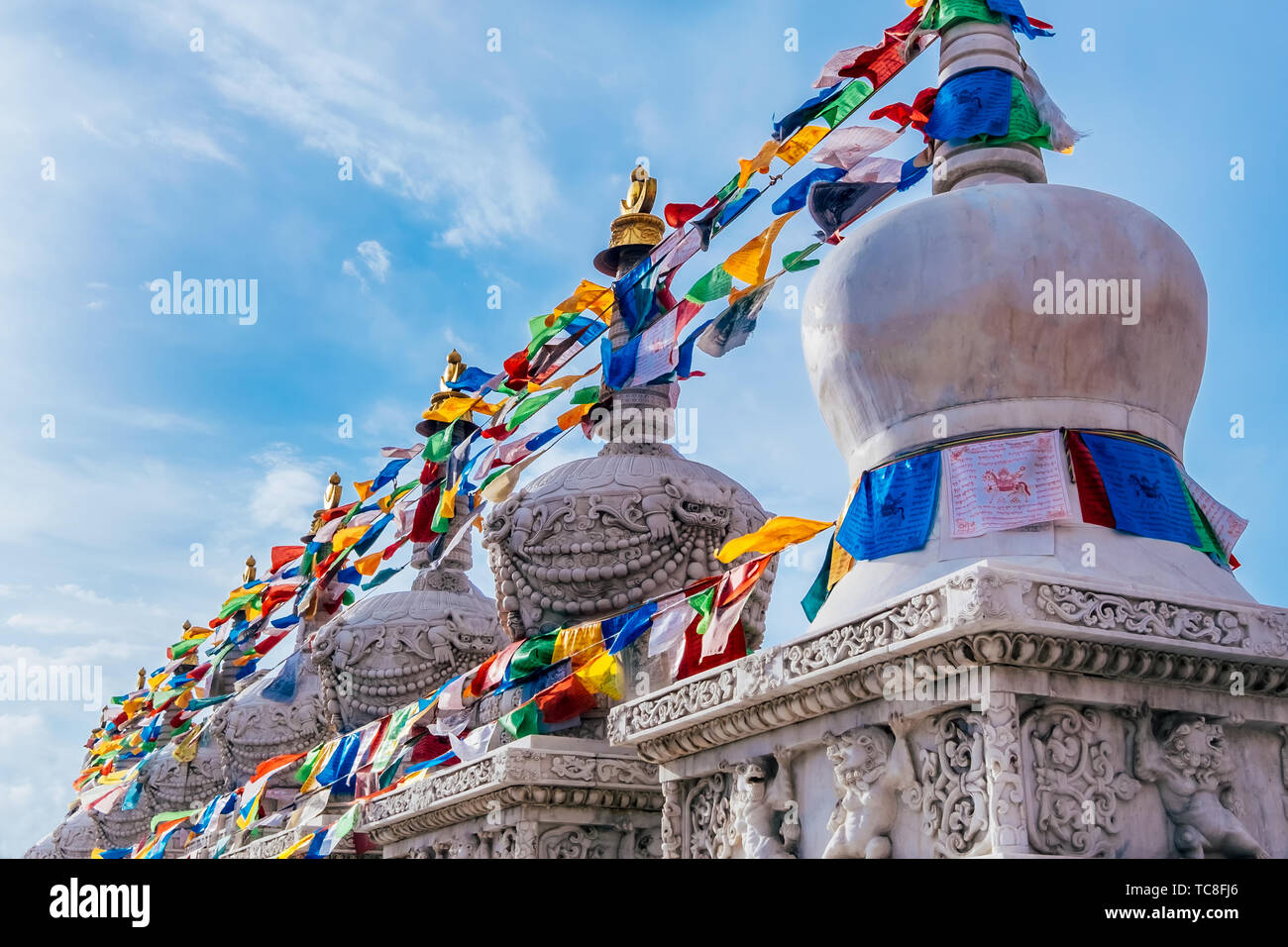 Lama pagoda and prayer flags in Dazhao Temple Tourism District, Hohhot ...