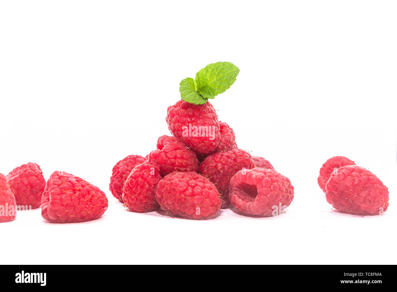 Fresh raspberries on white background Stock Photo - Alamy