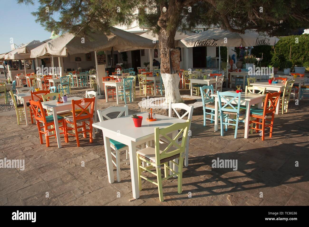 Table chairs greek taverna hi-res stock photography and images - Alamy