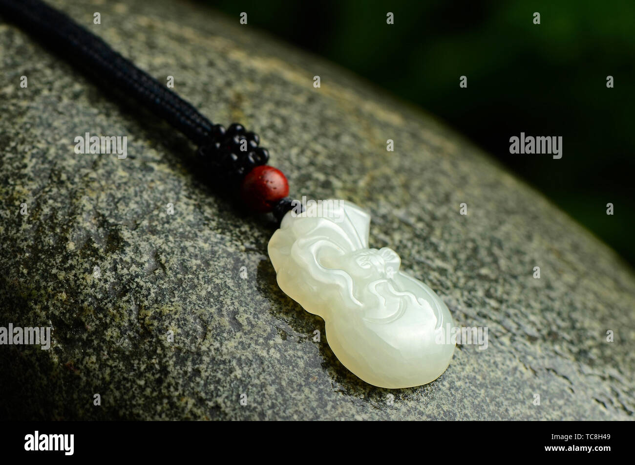 Money bag jade pendant Stock Photo - Alamy