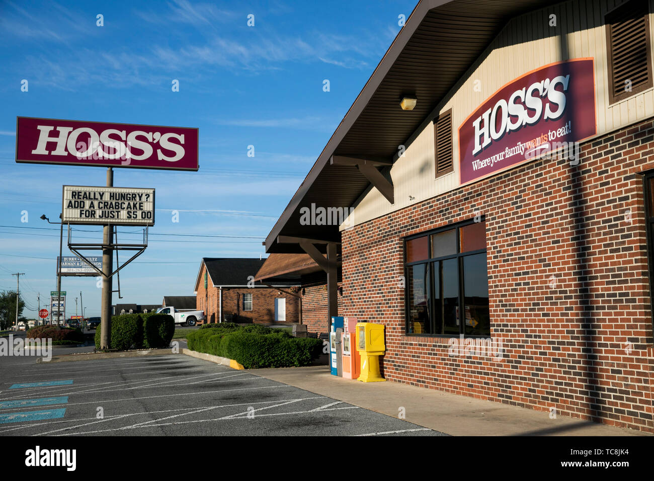 A logo sign outside of a Hoss's Family Steak and Sea restaurant ...