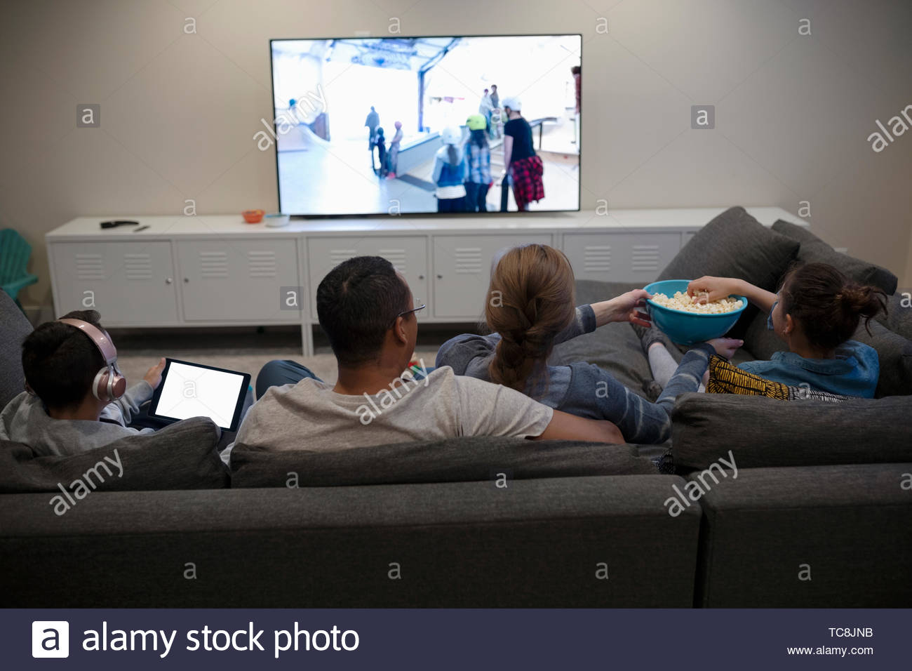 Watching computer family hi-res stock photography and images - Alamy