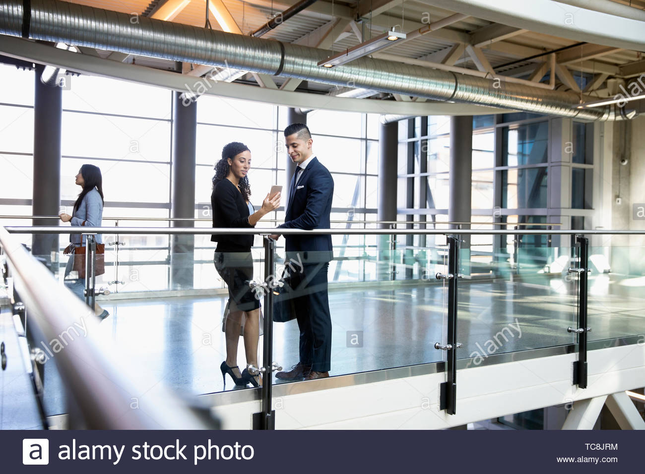 Two people talking on balcony hi-res stock photography and images - Alamy