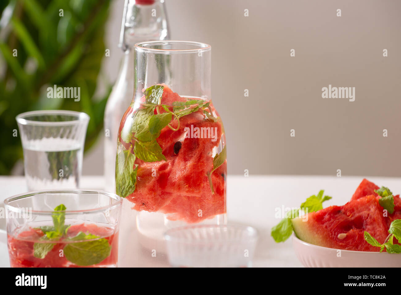 Watermelon infused water on white background Stock Photo - Alamy