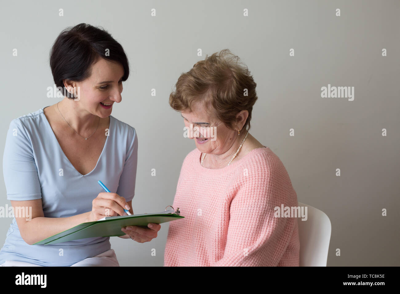Doctor appointment woman asking questions elderly female Stock Photo ...
