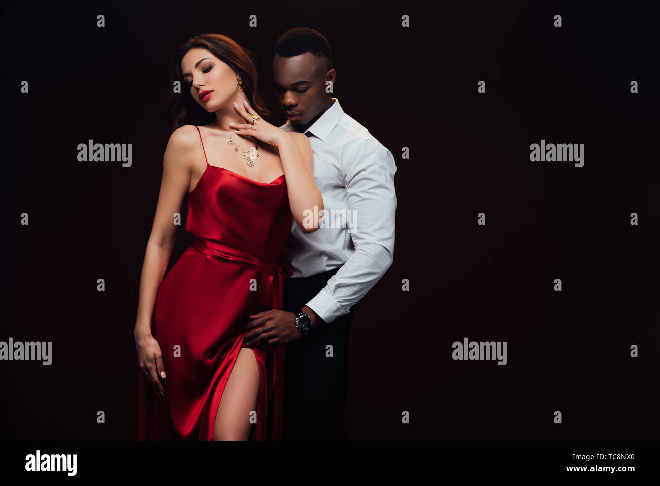Beautiful Seductive Interracial Couple In Formal Wear Posing Isolated
