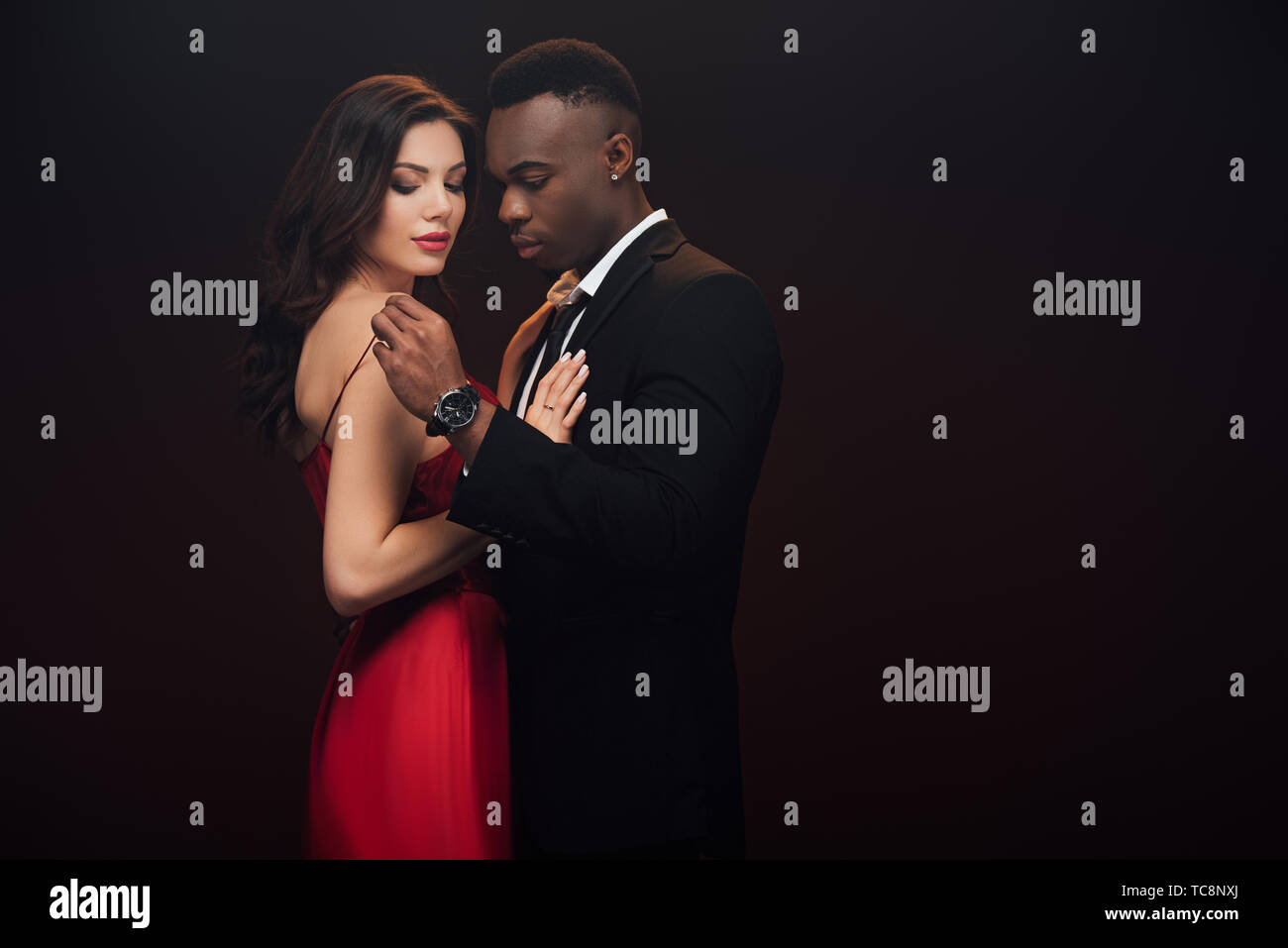 Beautiful Sensual Interracial Couple In Formal Wear Embracing Isolated