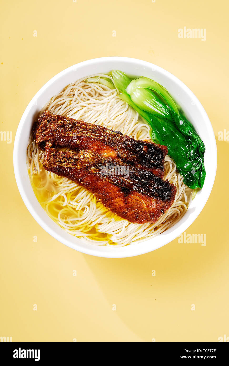 Fried fish noodles Stock Photo - Alamy