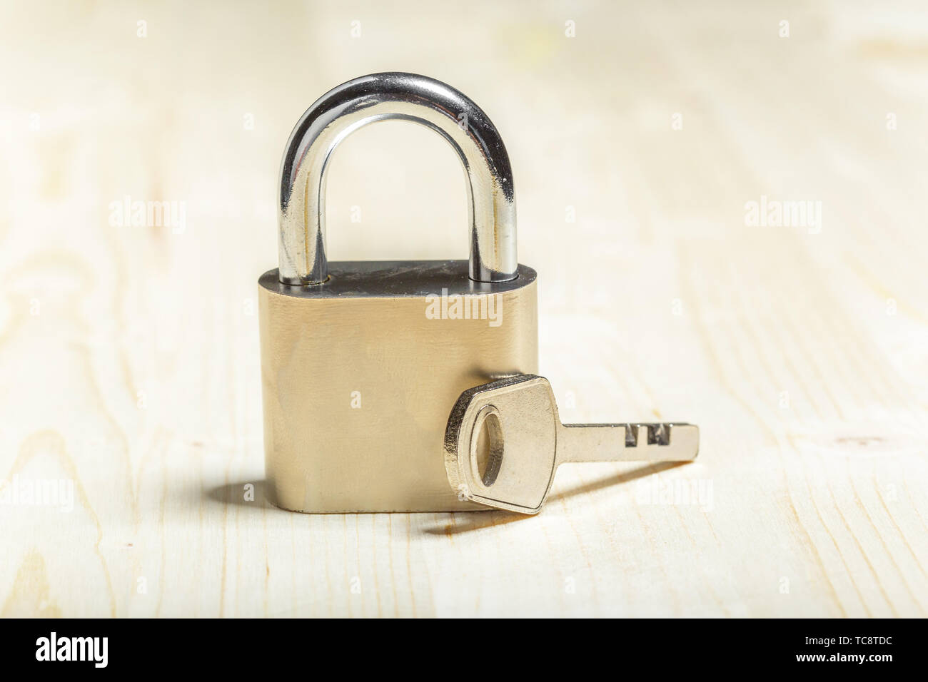 check-lock on the wooden table background Stock Photo - Alamy