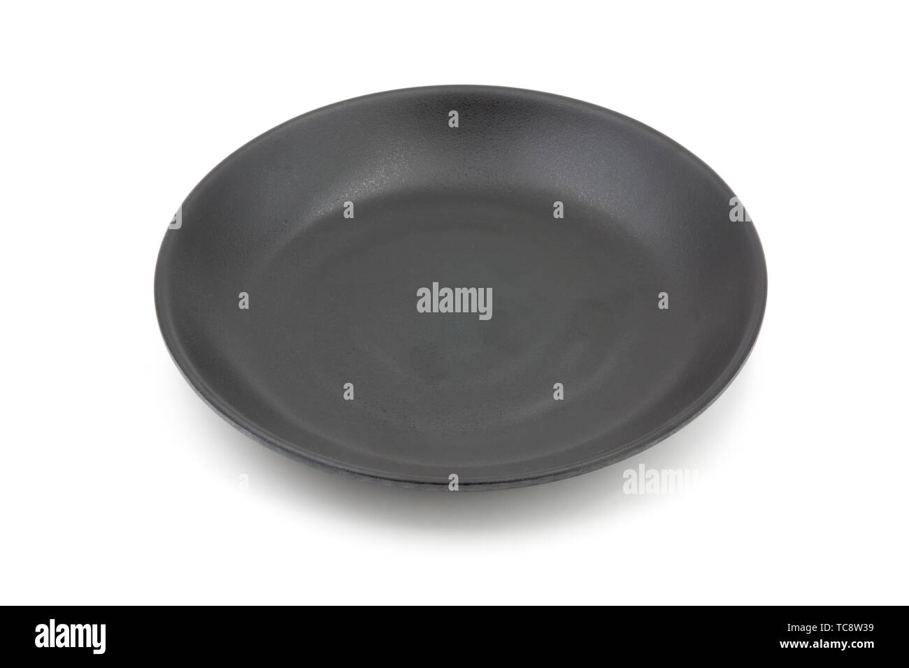 Black empty plate on white background Stock Photo - Alamy