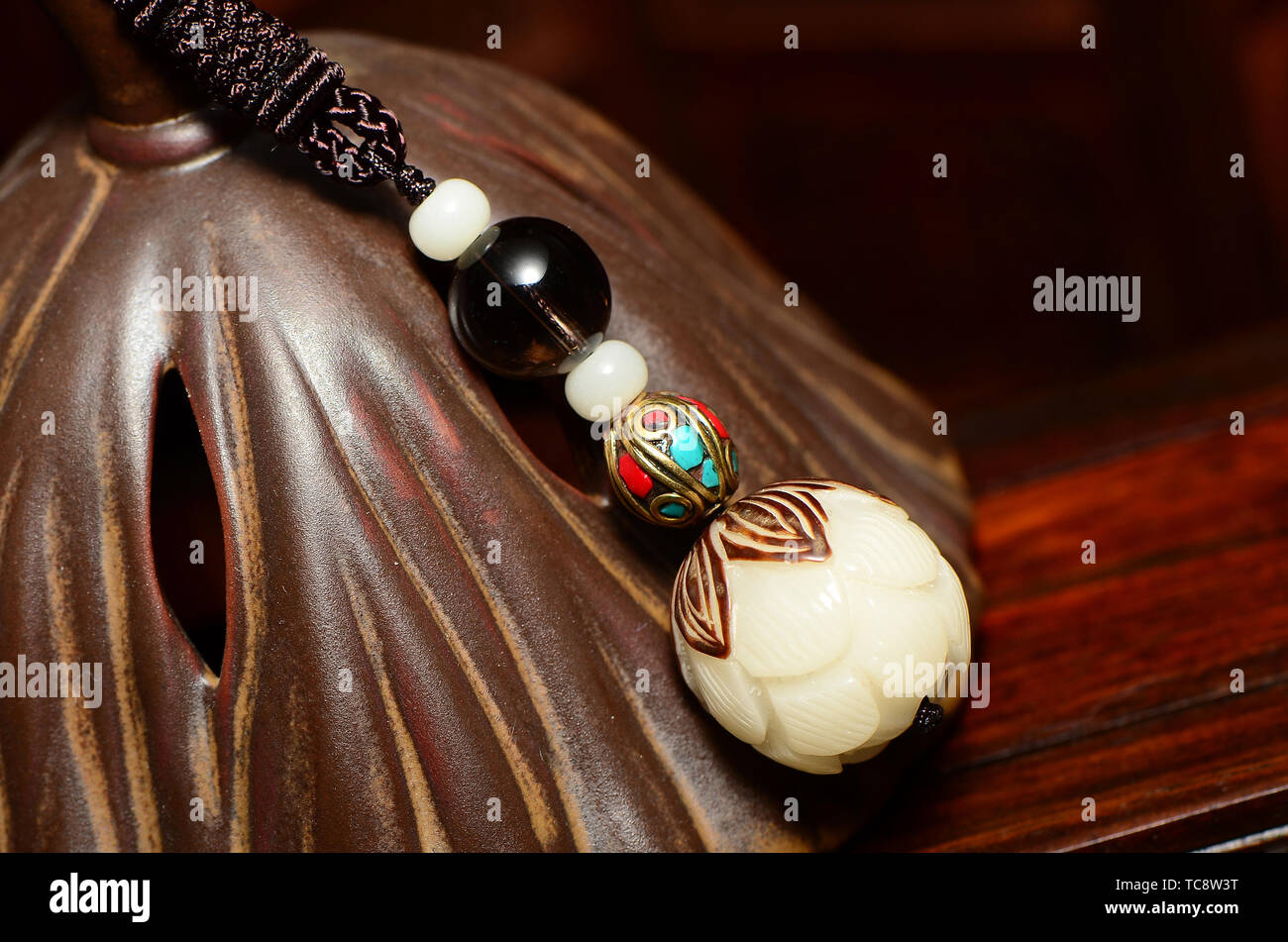 Bodhi pendant, necklace, wool chain Stock Photo - Alamy