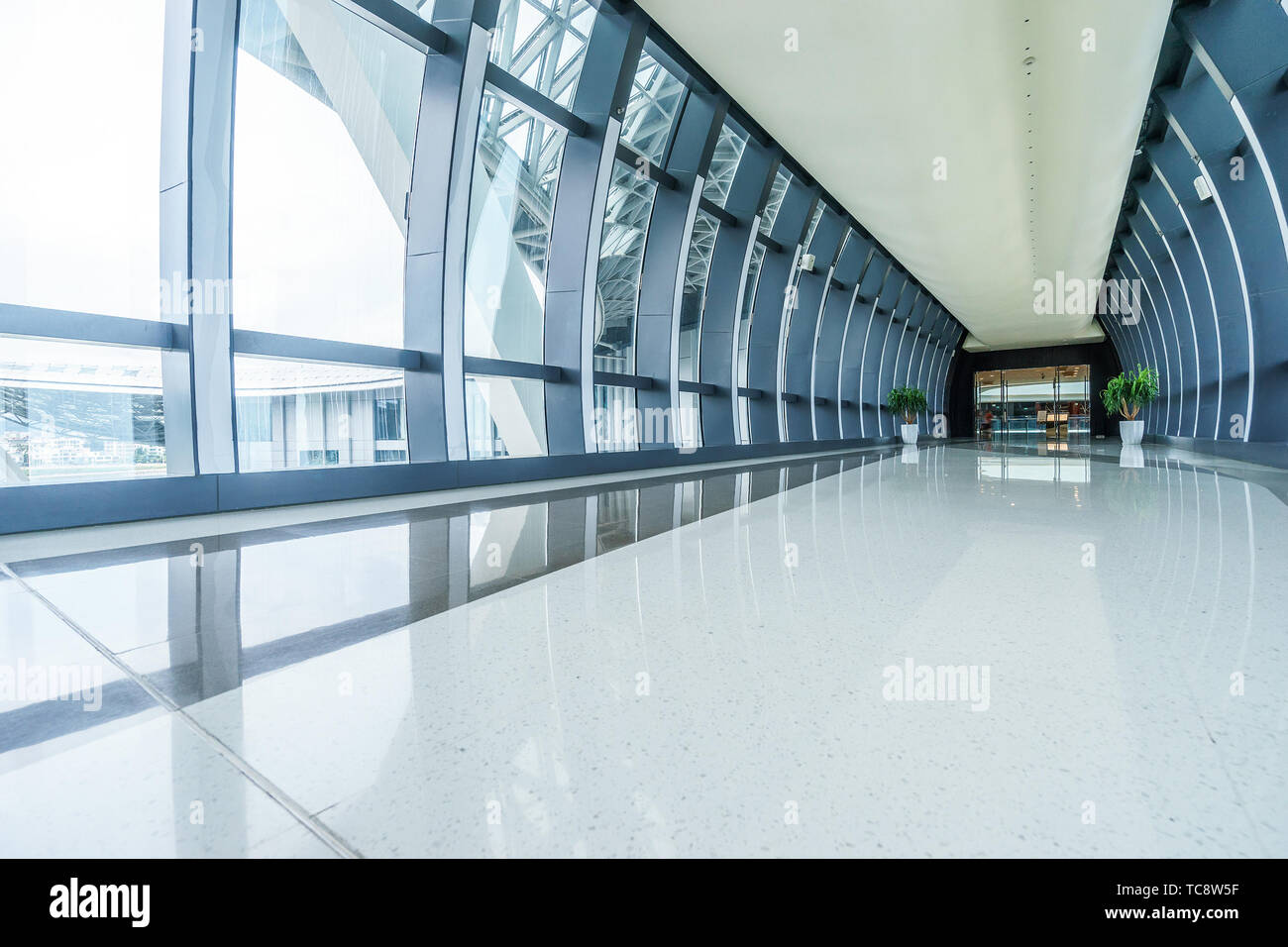 corridor with many glass windows in modern shopping mall Stock Photo ...
