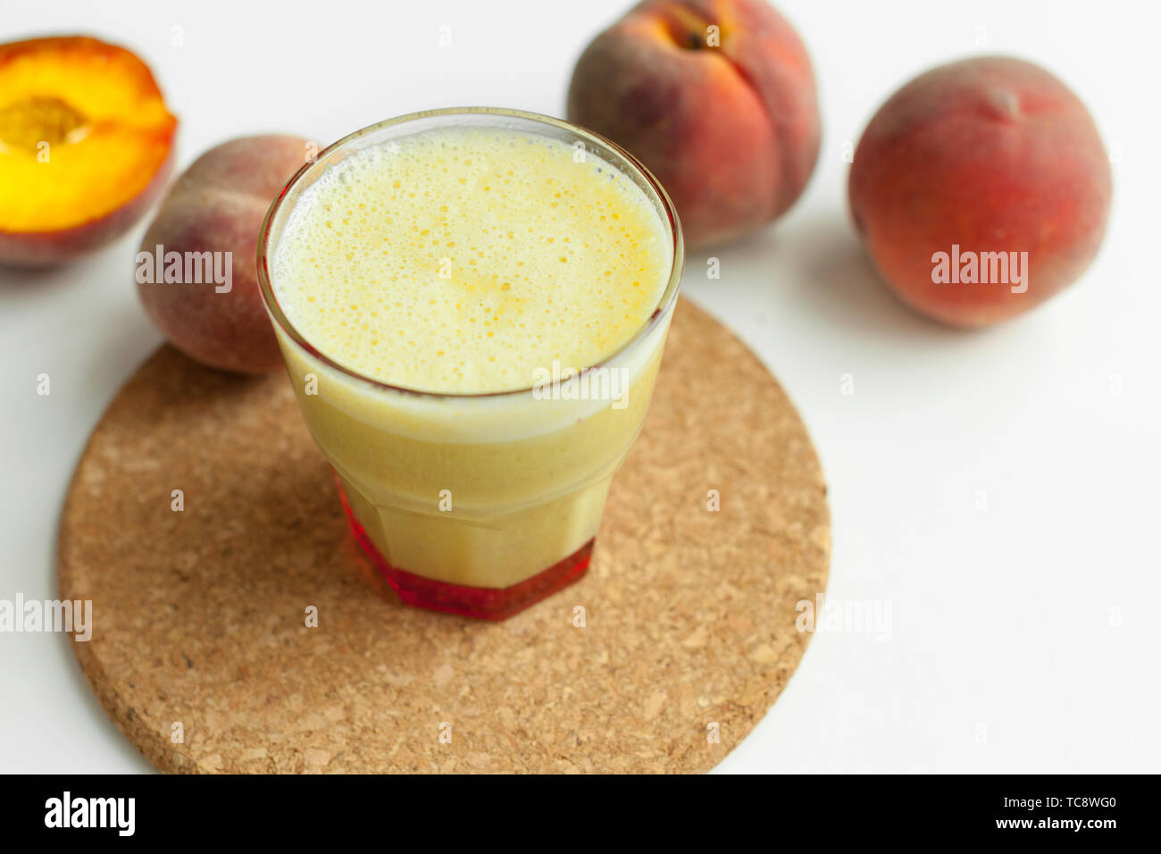 Glass of peach fresh Stock Photo - Alamy