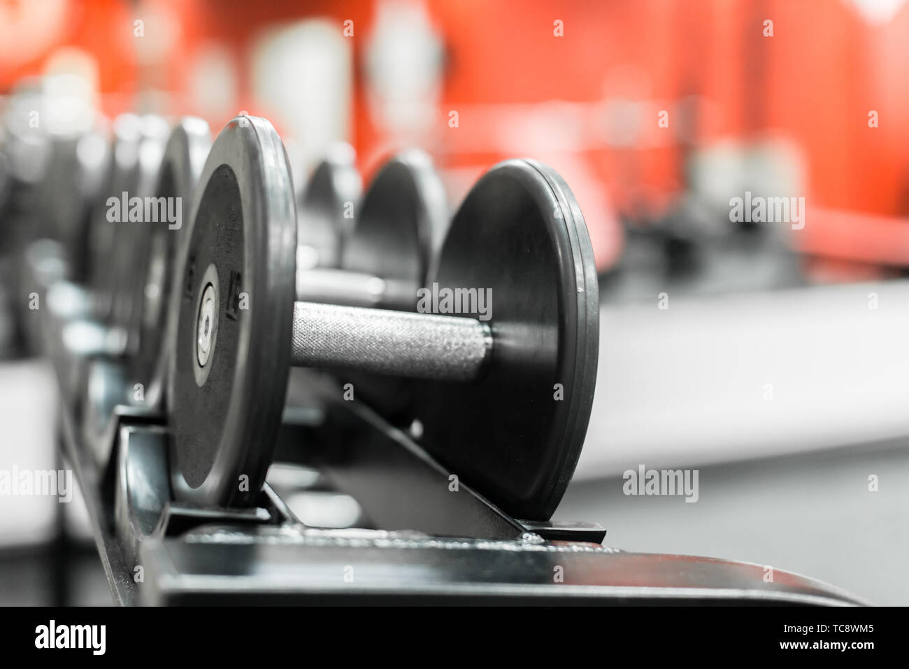 Dumbbells in the gym Stock Photo - Alamy