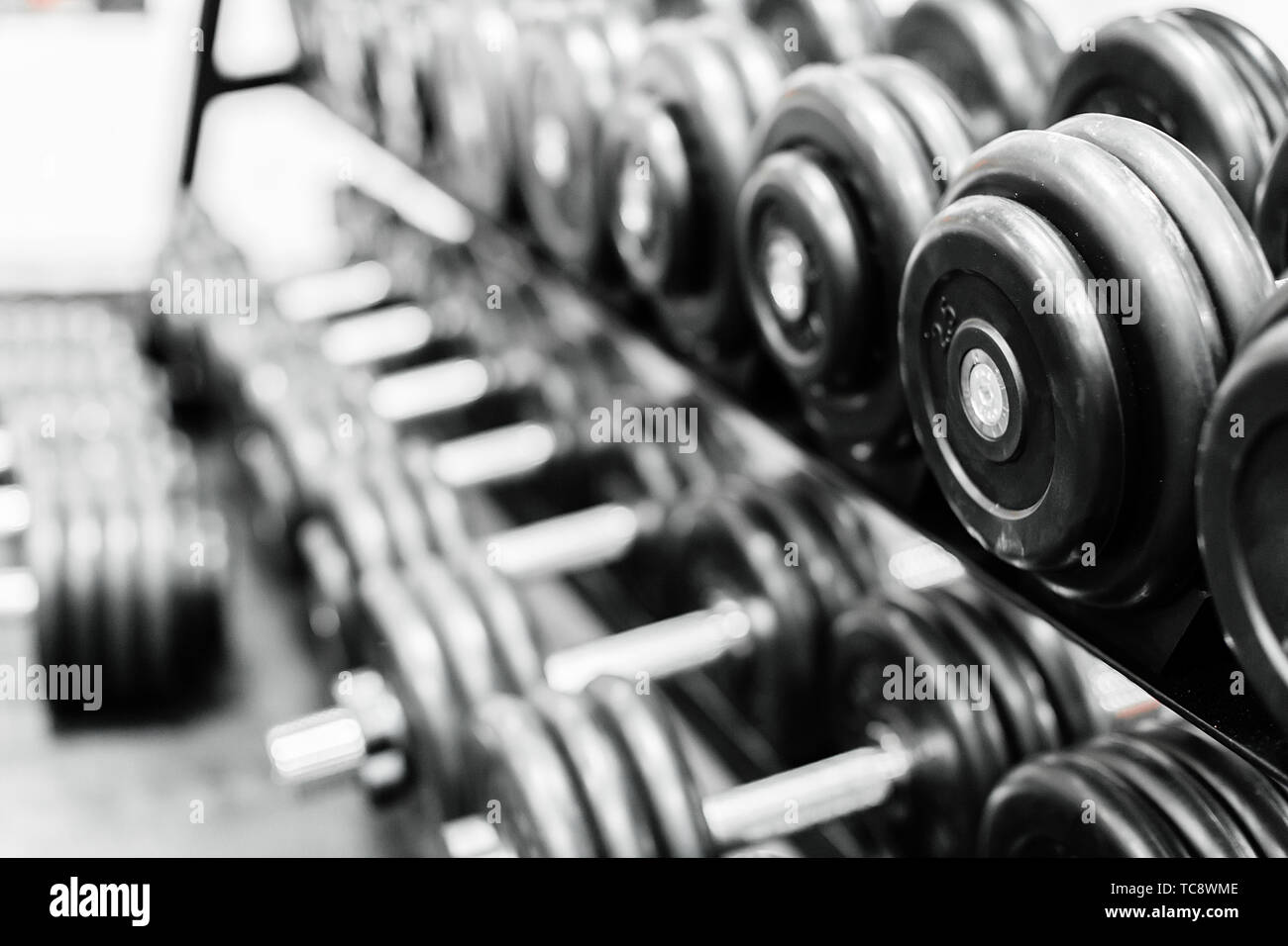 Dumbbells in the gym Stock Photo - Alamy