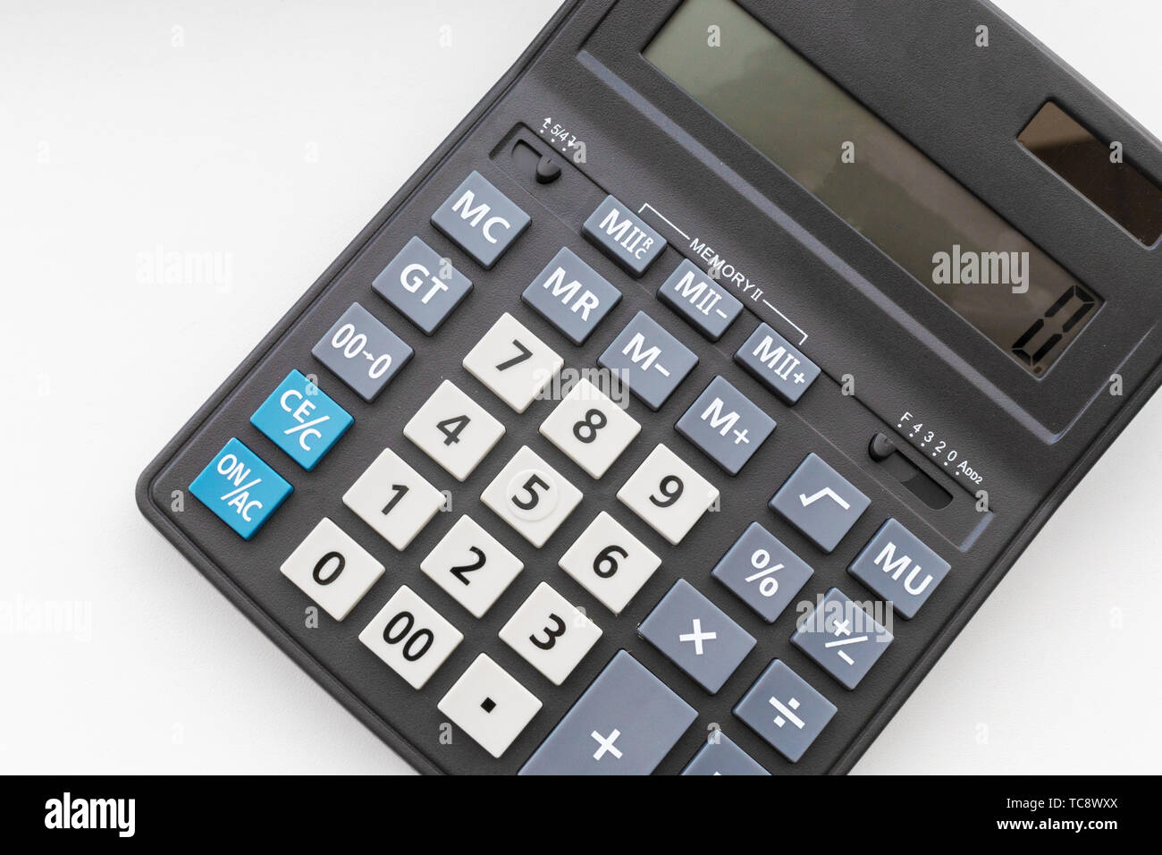 Calculator on white background Stock Photo - Alamy