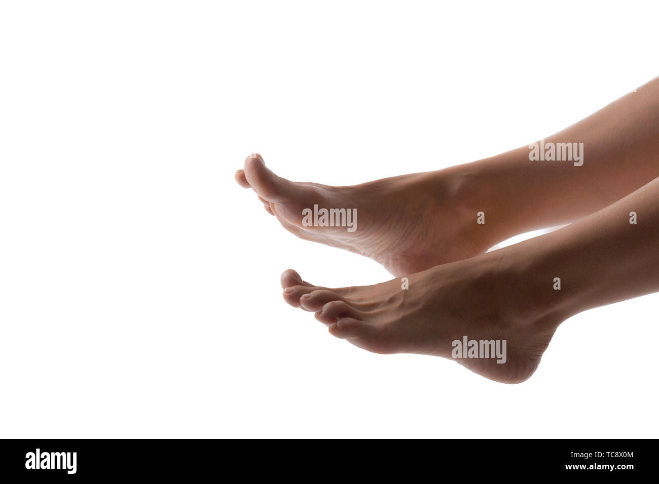 Beautiful women feet isolated on white close-up Stock Photo - Alamy