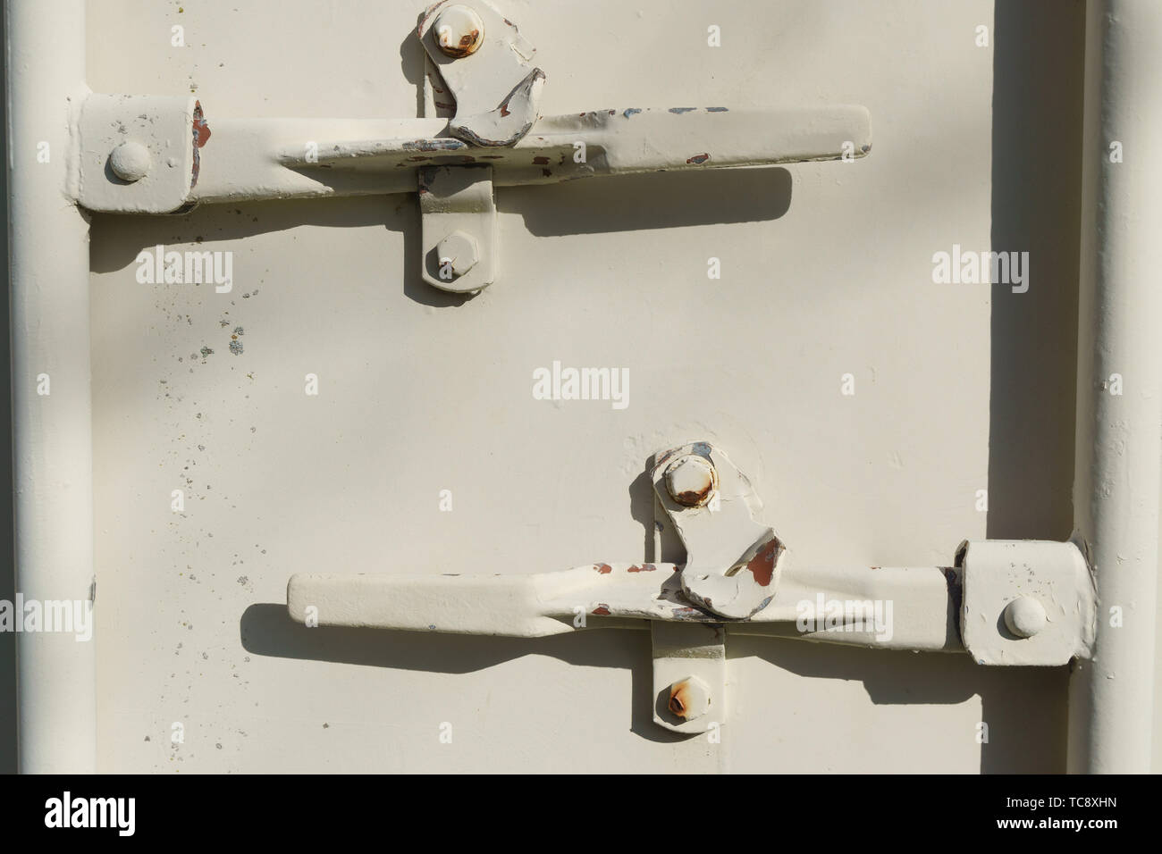 White shipping container door latches Stock Photo - Alamy