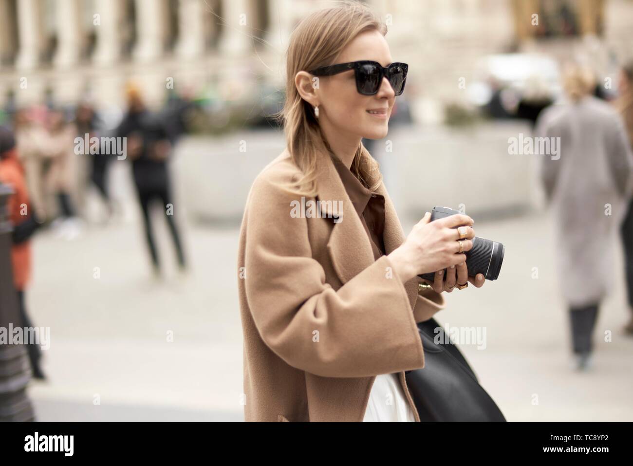 fashionable blogger woman with camera during fashion week, style ...