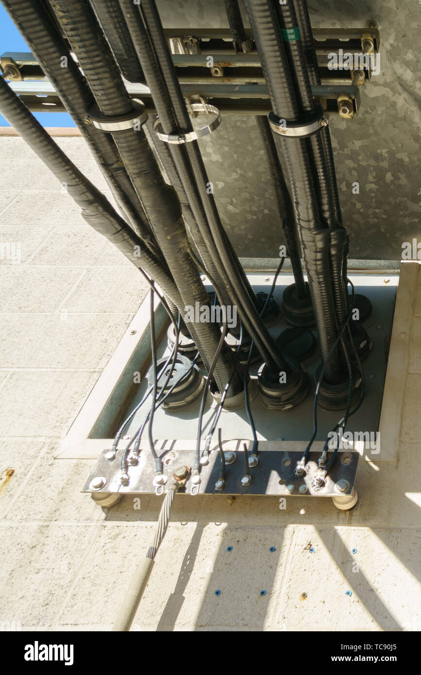 Waveguide Cables going into building Stock Photo - Alamy