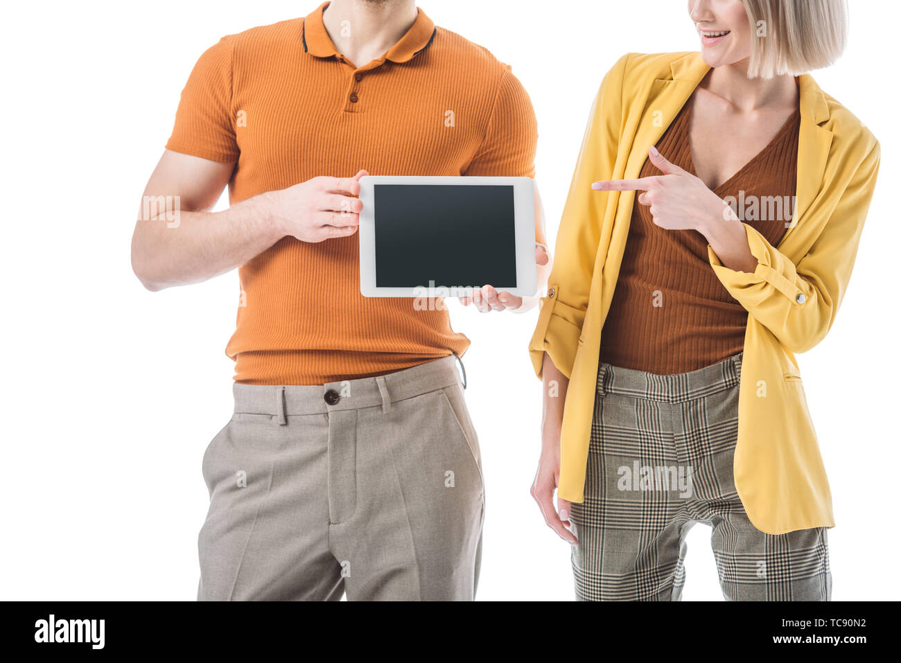 cropped view of man holding digital table with blank screen, while ...