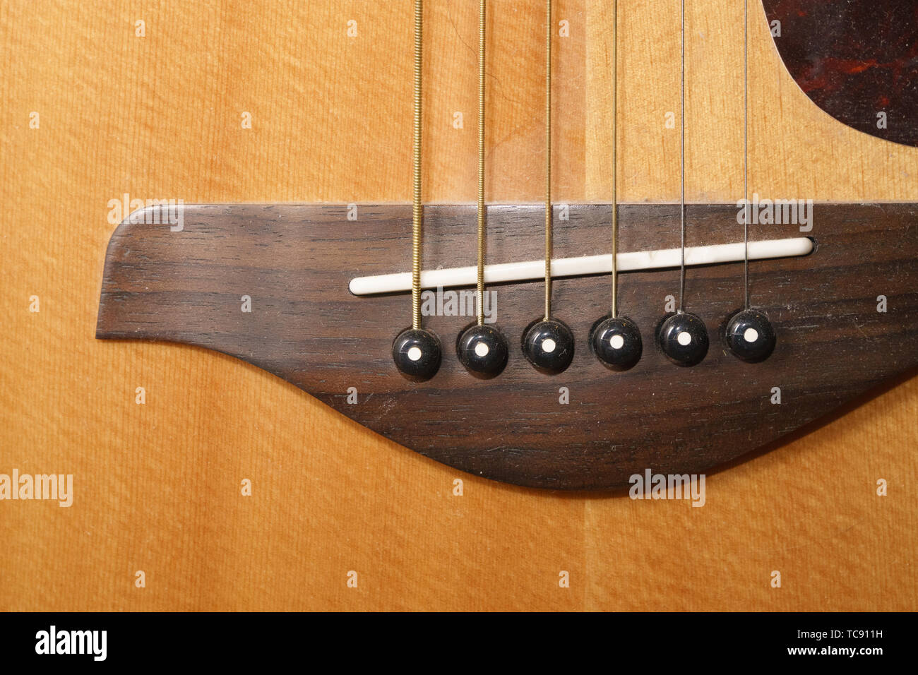 Acoustic guitar bridge Stock Photo - Alamy