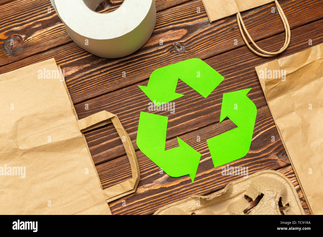 Eco concept with recycling symbol on table background top view Stock ...