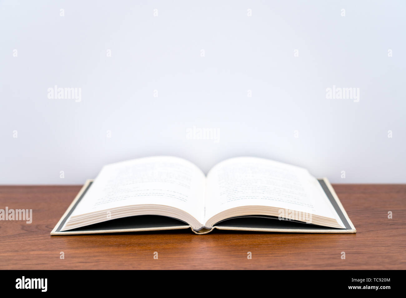 An open book on the desk Stock Photo - Alamy