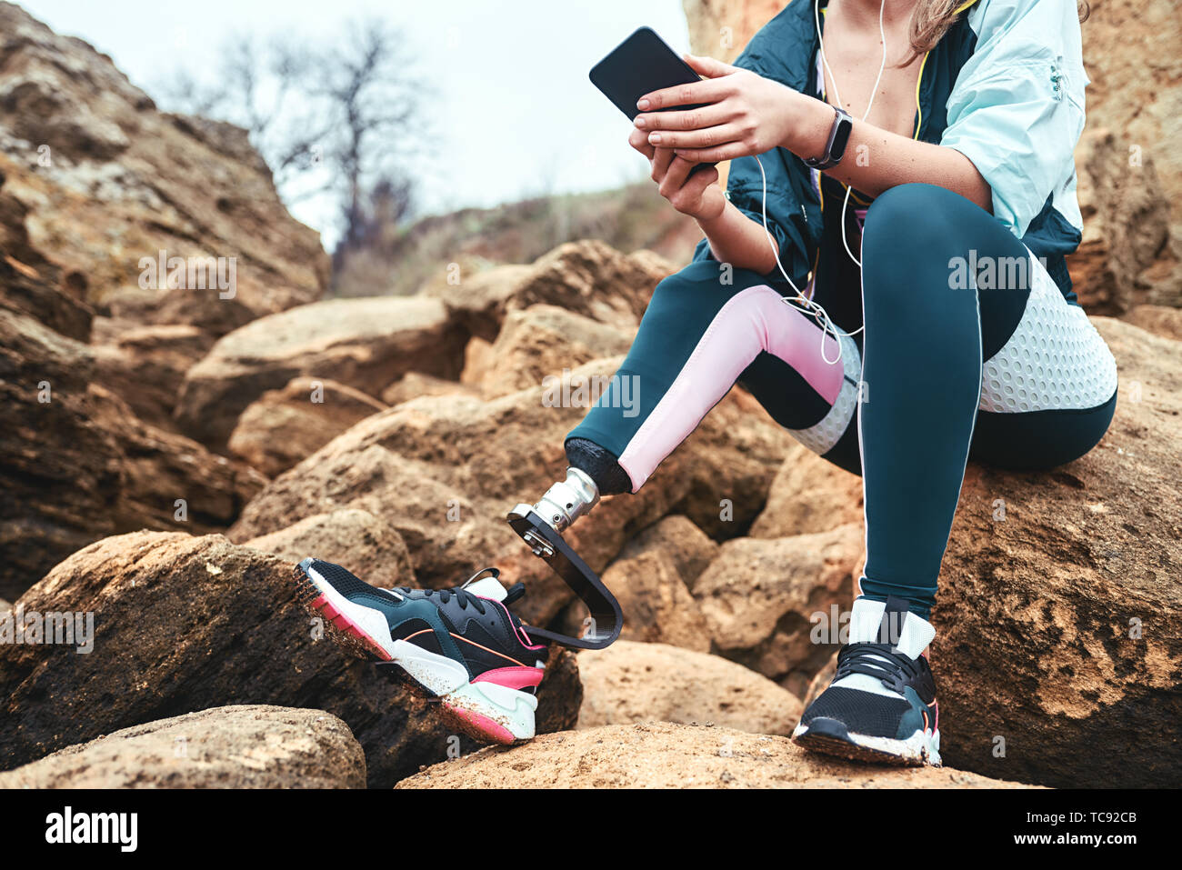 Digital technologies. Cropped image of disabled women in sport wear ...