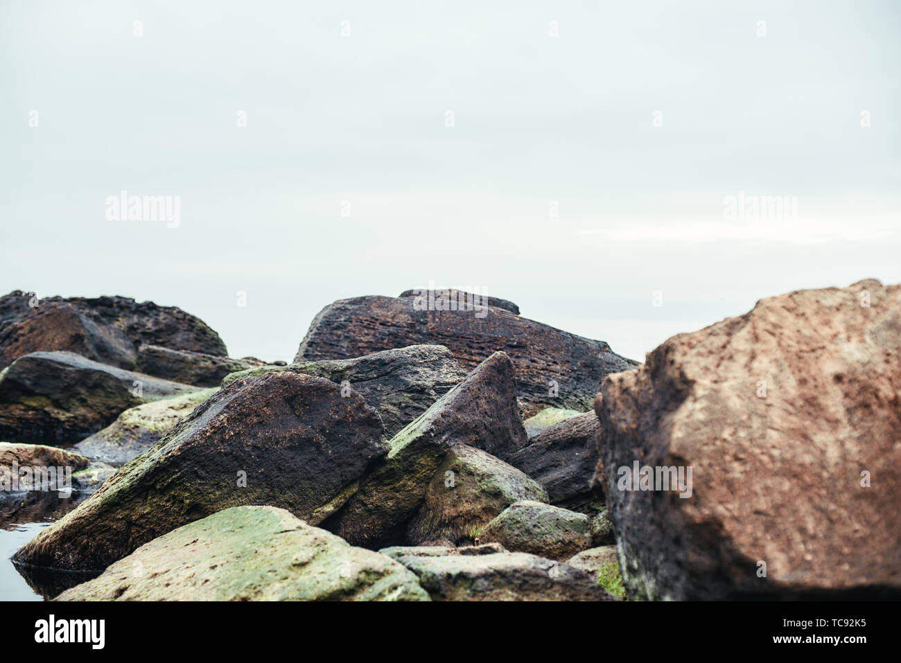 Close up photo of big boulders on the beach. Nature landscape. Sky and ...