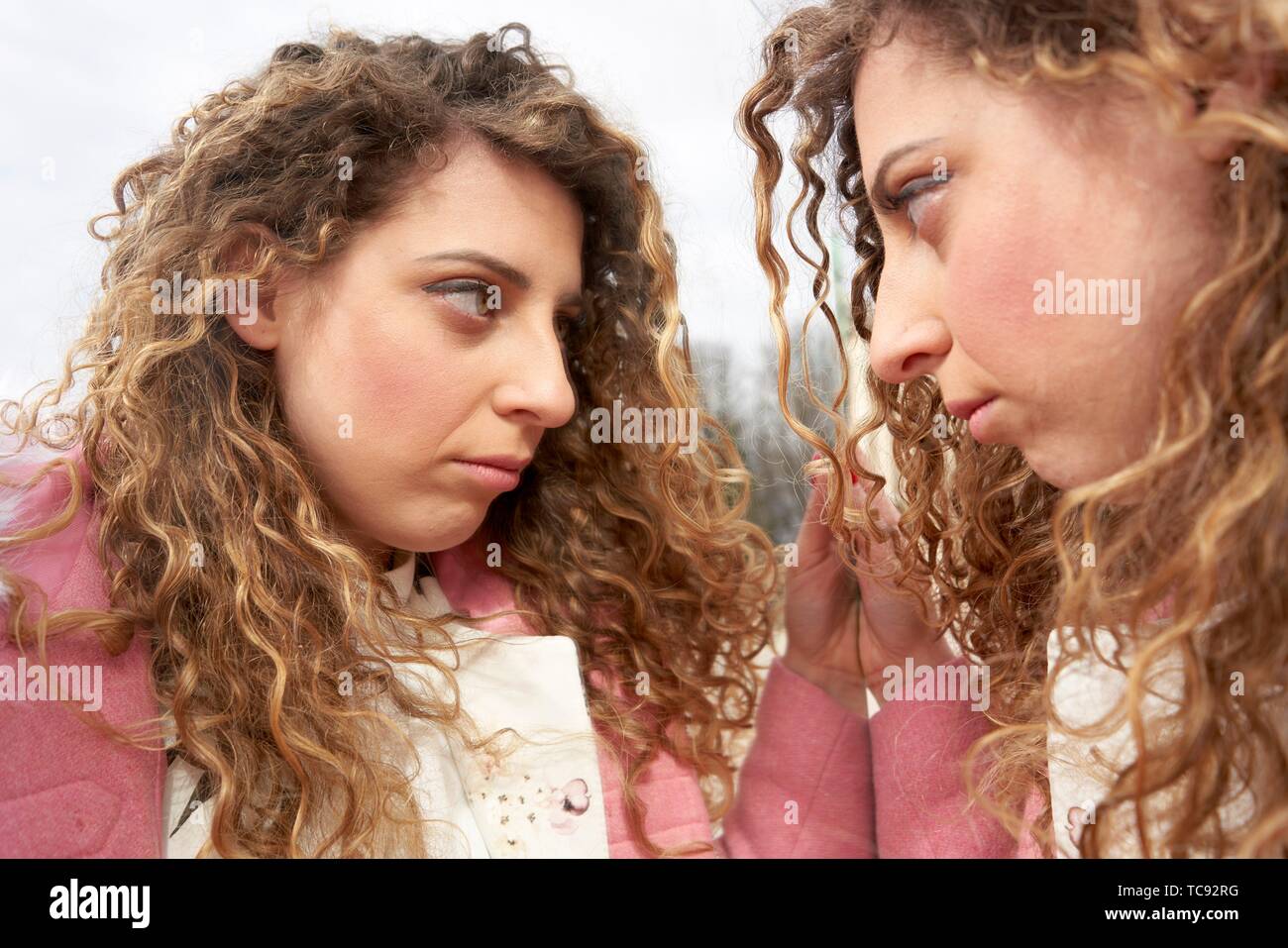 self critical woman looking at herself, in Paris, France Stock Photo ...