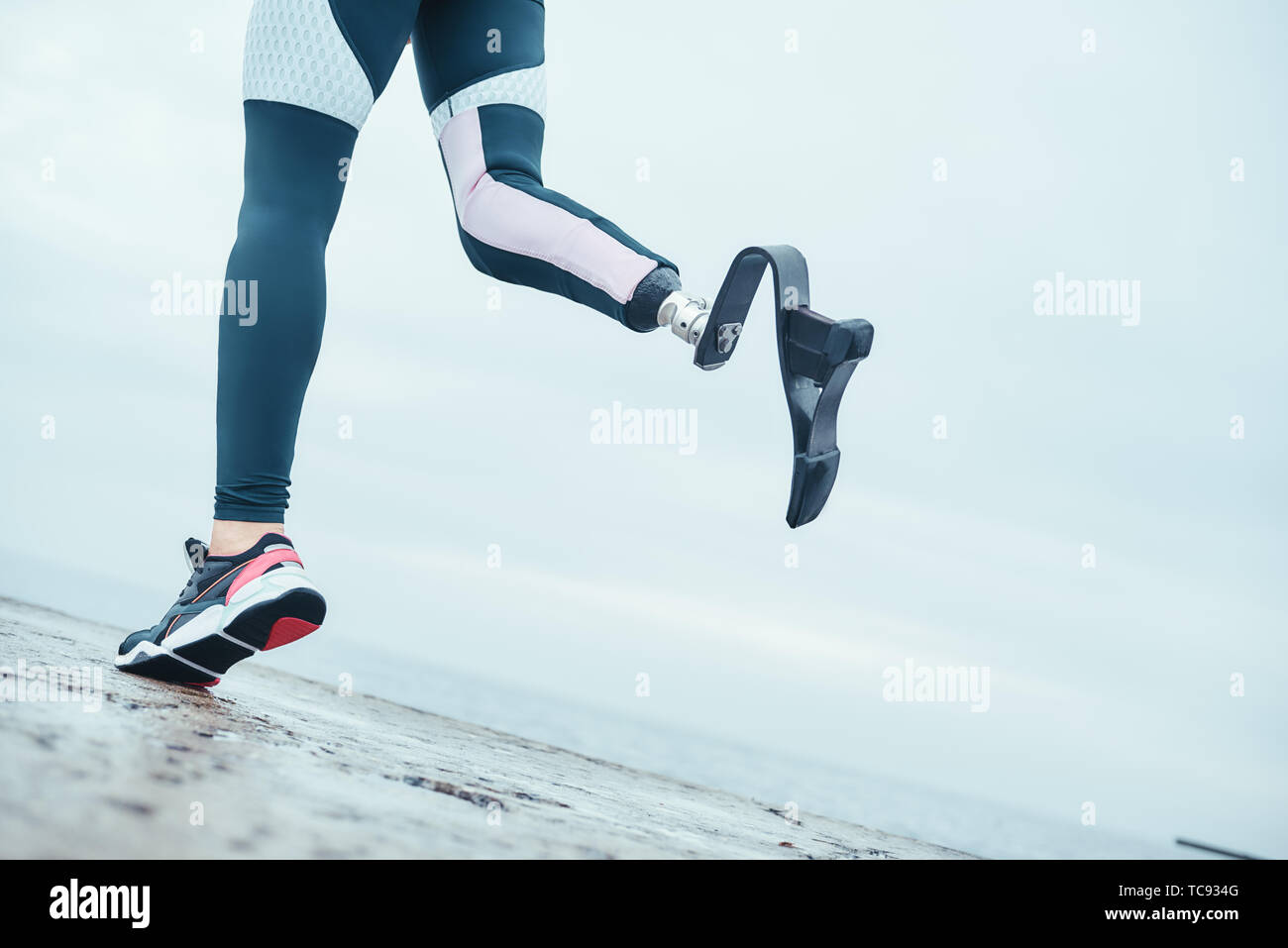 Life is in your hands. Cropped photo of disabled woman with bionic leg ...