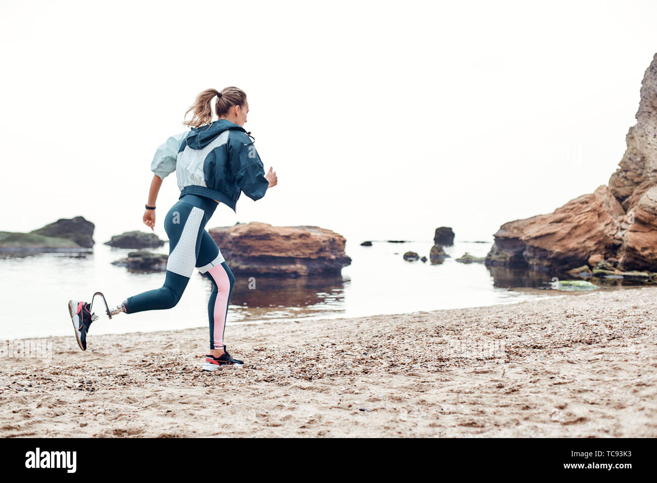 Take care of your body. Side view of strong disabled woman in ...