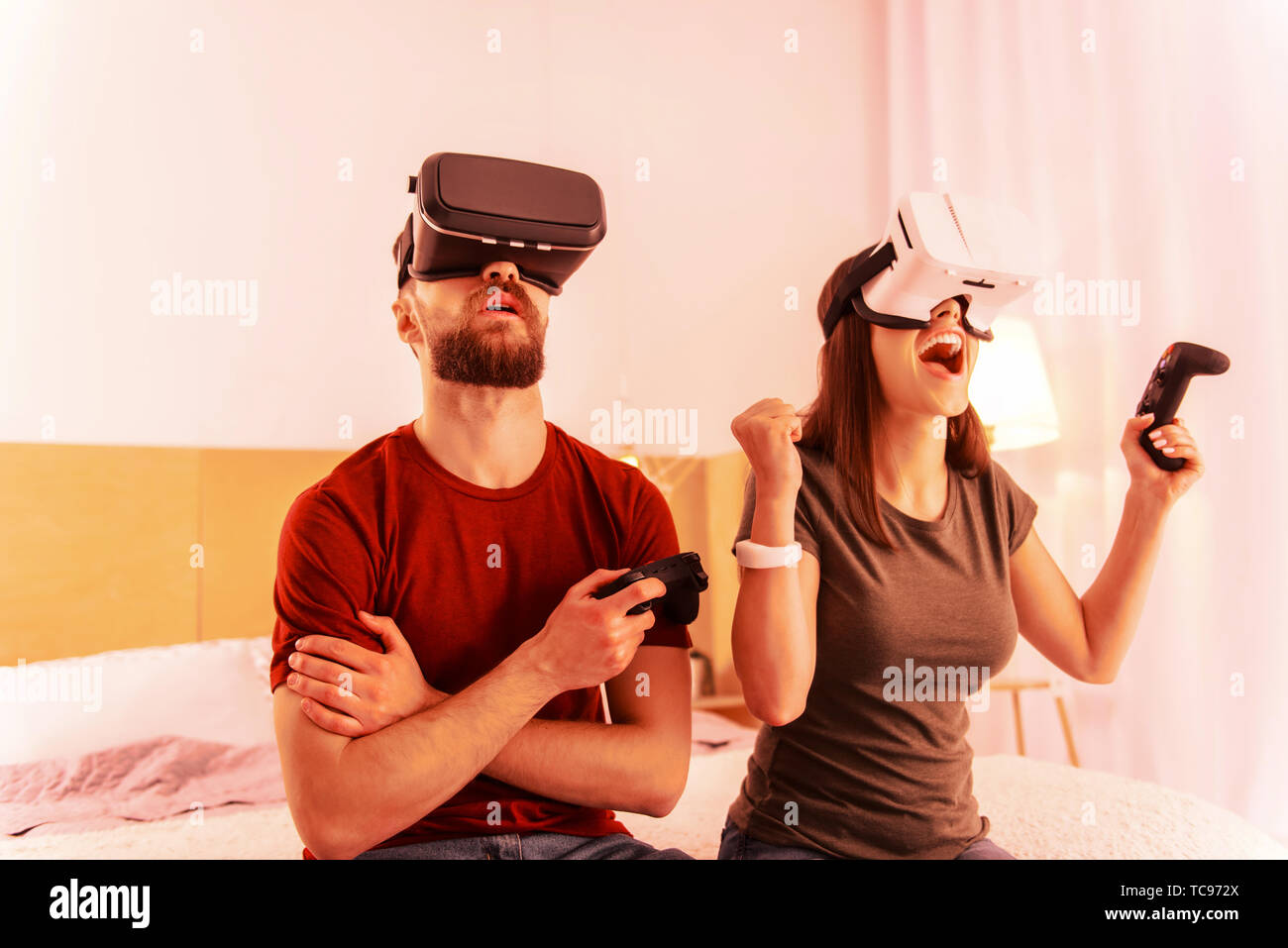 Modern couple having fun together at home Stock Photo - Alamy
