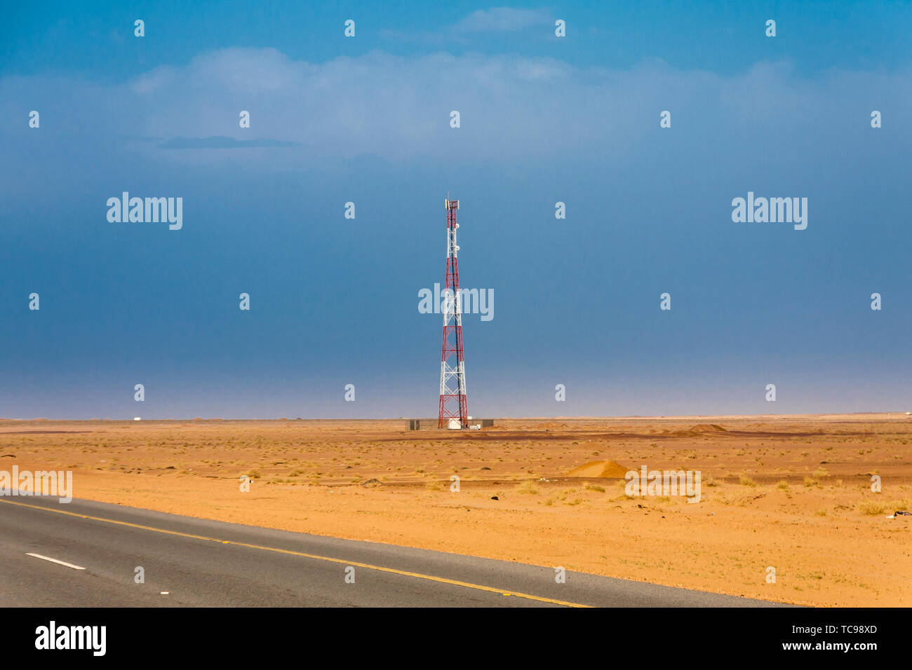 A mobile tower in the desert near the paved road in Saudi Arabia Stock ...