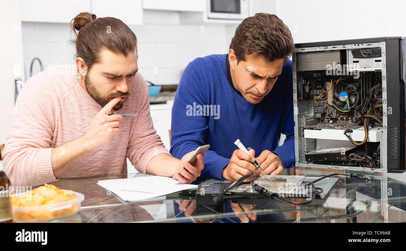 Men do not know how to repair a computer Stock Photo - Alamy